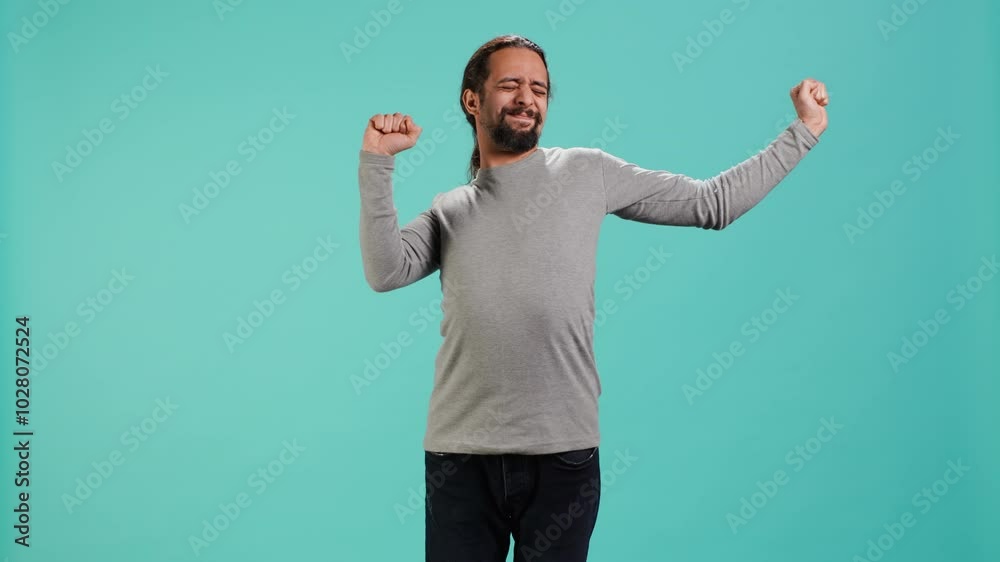 Portrait of man stretching his body, experiencing fatigue and tension ...