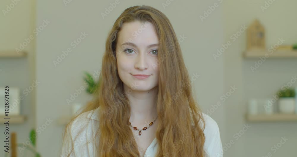 Beautiful smiling confident young woman pretty face looking at camera ...