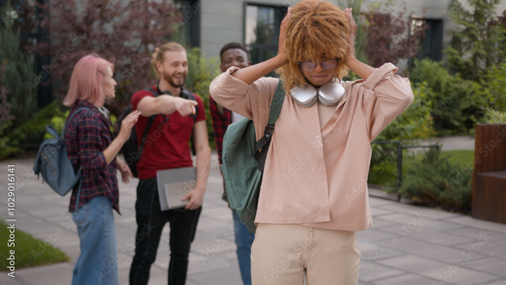 Group of angry students teenagers multiracial classmates mock humiliate ...