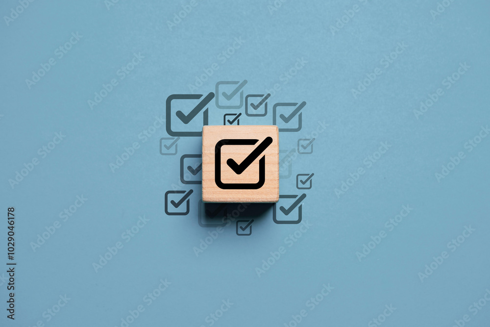 Black correct sign mark on wooden block cube for project and document ...