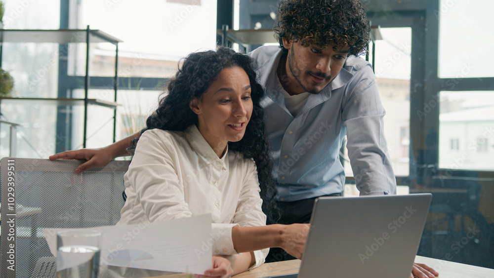 Indian businessman mentor coach help Arabian businesswoman with laptop ...