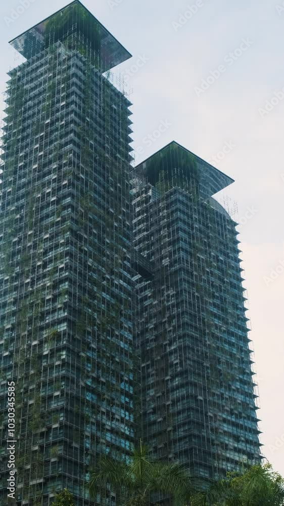 Contemporary skyscrapers twin tower building with vertical gardens ...