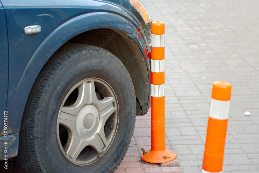 Car bumps into plastic pole while parking in parking lot. Small ...