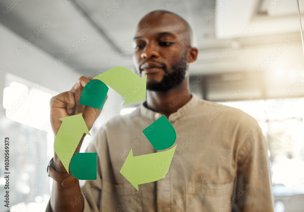 Business, black man and recycle logo on glass wall with marker for eco ...