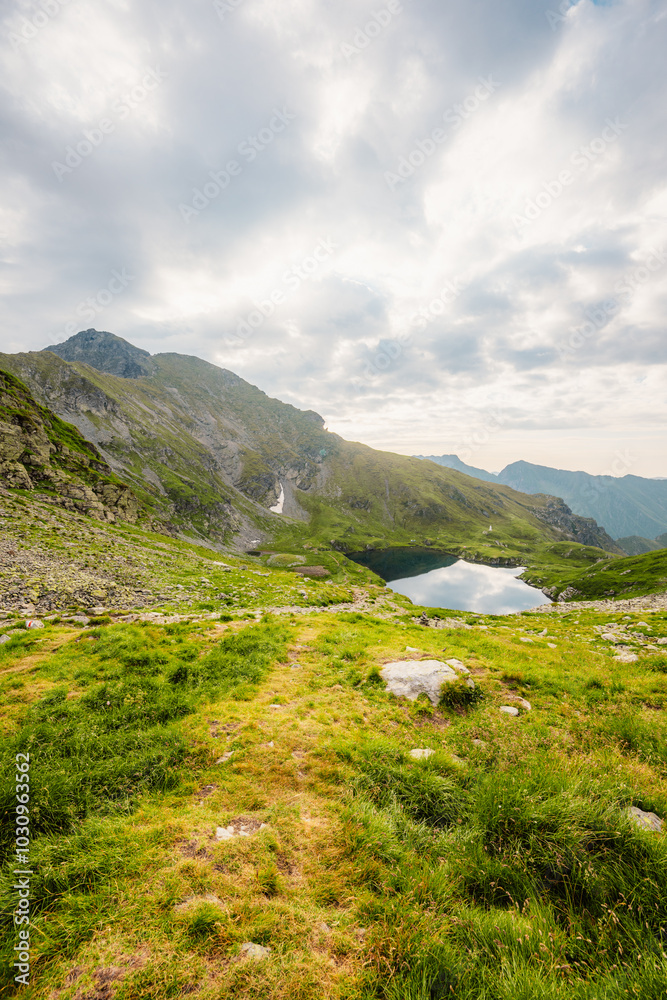 Hiking in Fagaras mountains on Iezerul Caprei peak over Transfagarasan ...