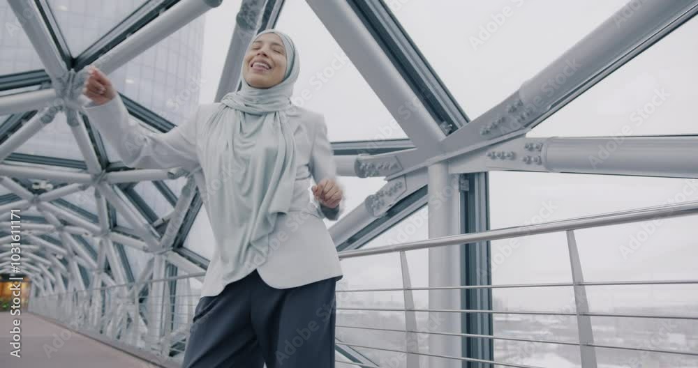 Slow motion of happy Middle Eastern businesswoman in hijab dancing and ...