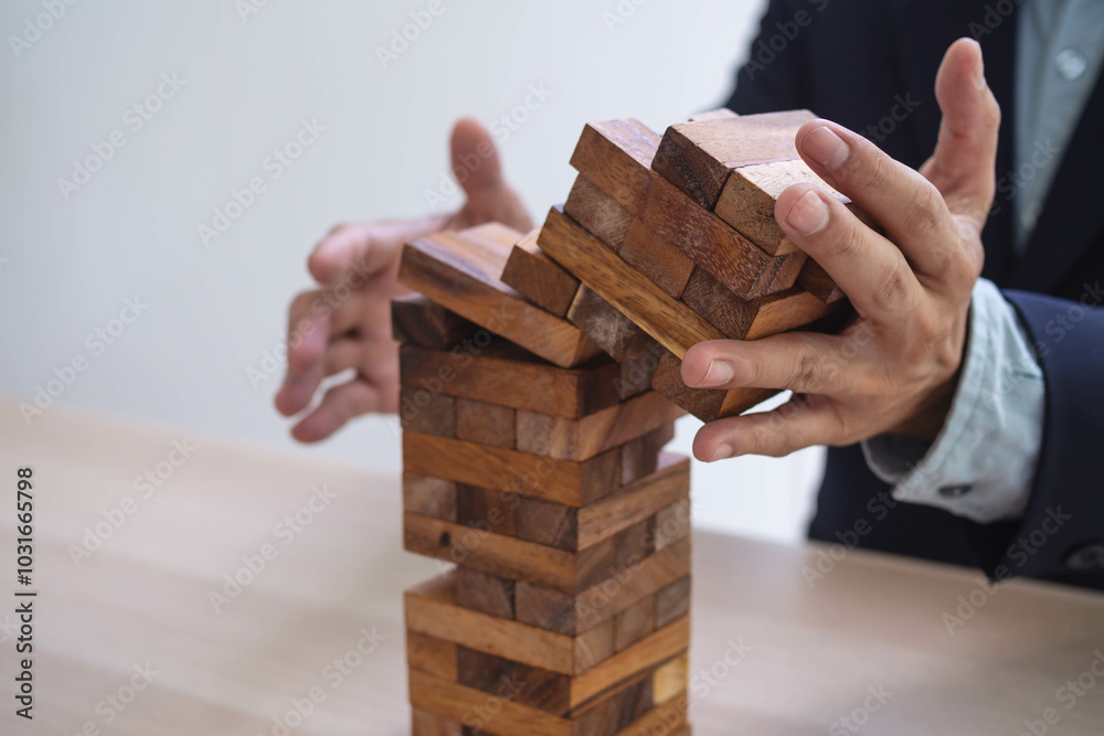 Business failure concept. businessman built block tower and tower are ...