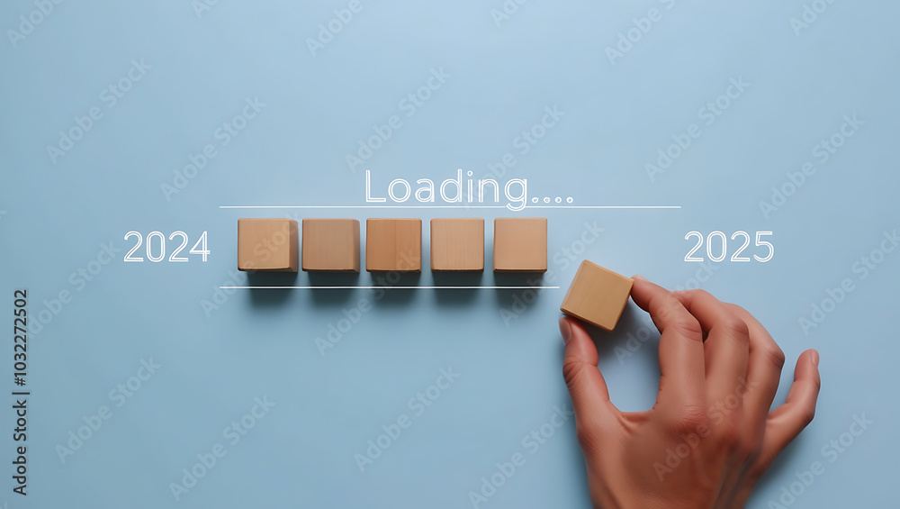 2025 loading, 2024 to 2025 loading wooden bar. A hand places wooden ...