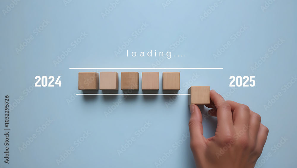 2025 loading, 2024 to 2025 loading wooden bar. A hand places wooden ...
