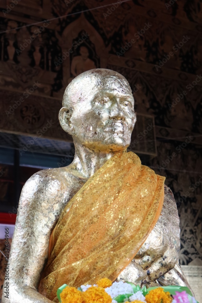 A glorious silver statue draped in golden fabric an iconic ...