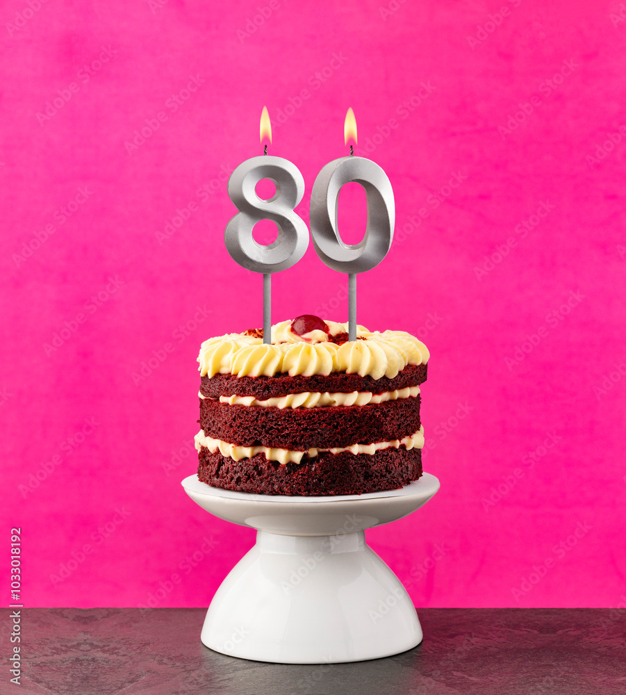 Birthday cake with number 80 candle - Red velvet on a fuchsia ...