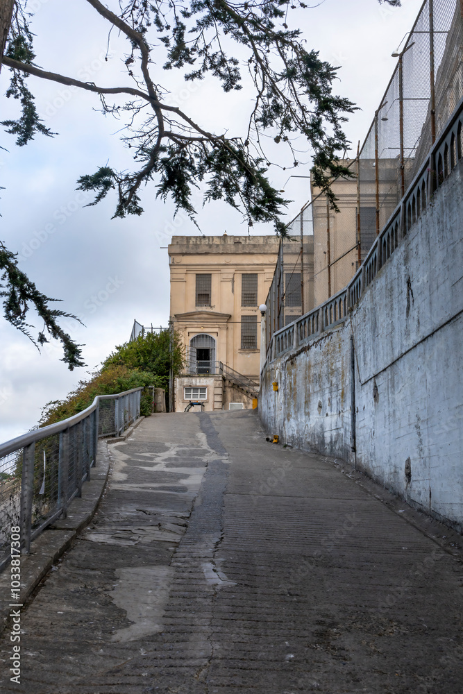 Poster View of a pathway leading to a historic building on Alcatraz ...