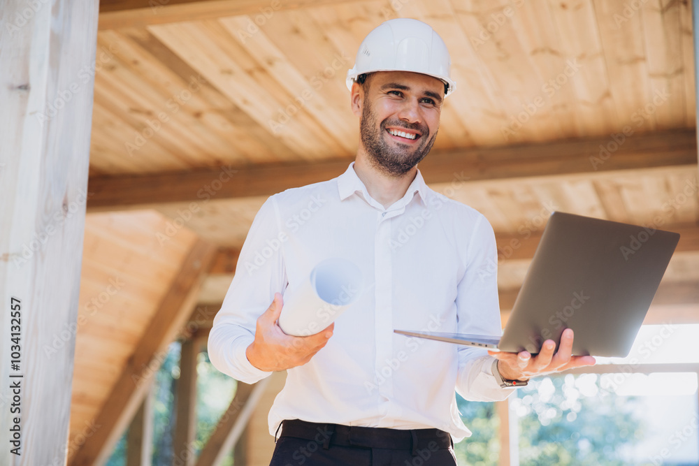 Man builder. Foreman with laptop. Contractor for construction company ...