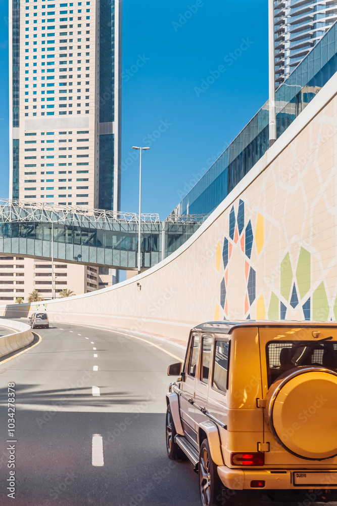 Car traffic on a highway road with skyscrapers in Dubai UAE. Highway ...