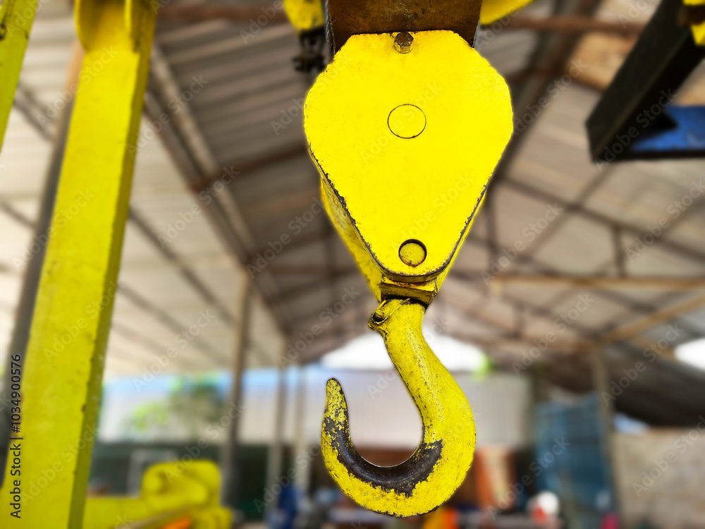yellow crane hook on a construction site, Tower crane hook ...