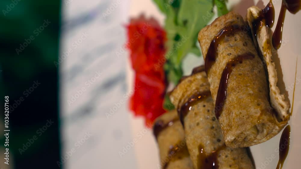 Savor the flavors of hand-rolled delicacies paired with a zesty dipping ...