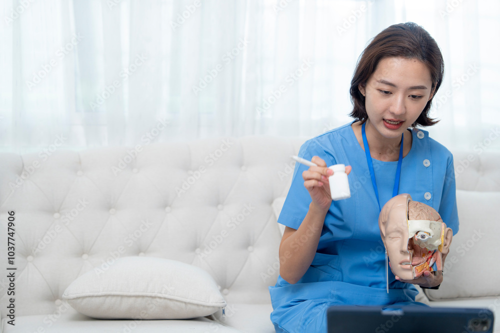 A medical professional in blue scrubs conducts an online lesson ...