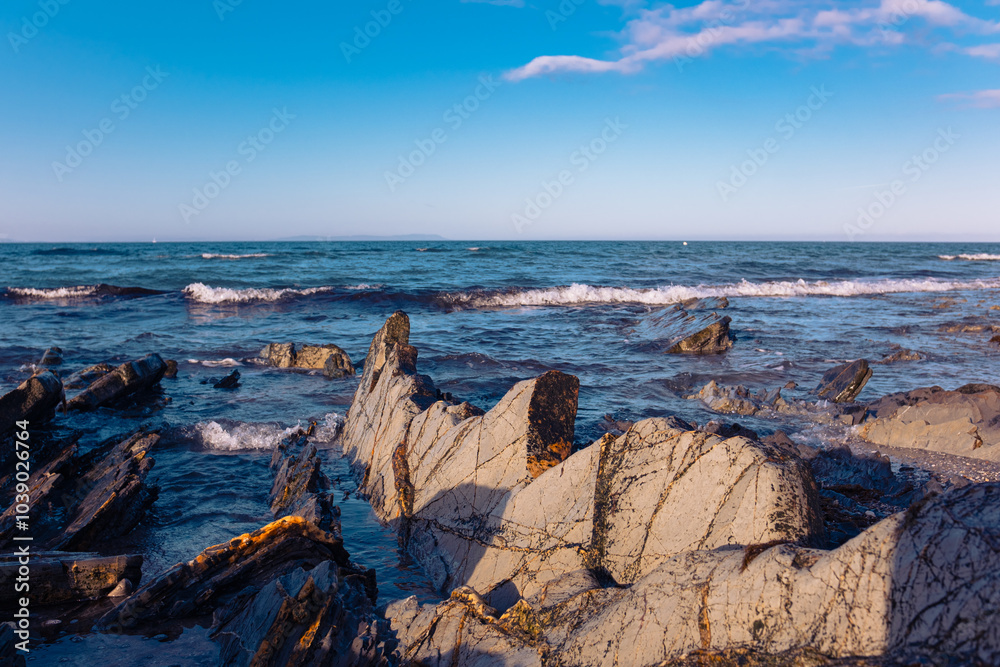 Beautiful sharp stones on the seashore, washed by the waves. Stone ...