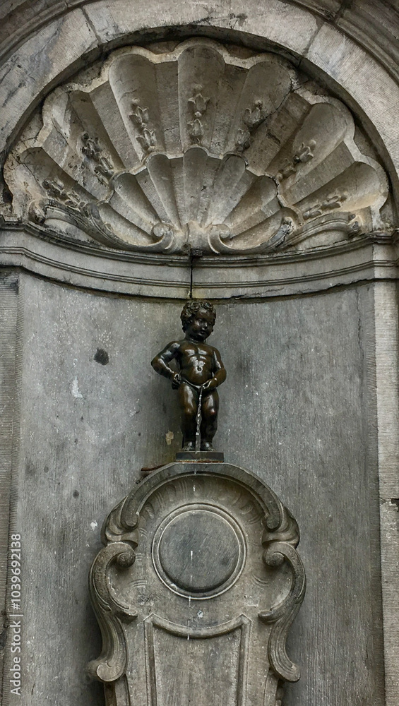 Bronze statue of a boy urinating, known as Manneken Pis in Brussels ...