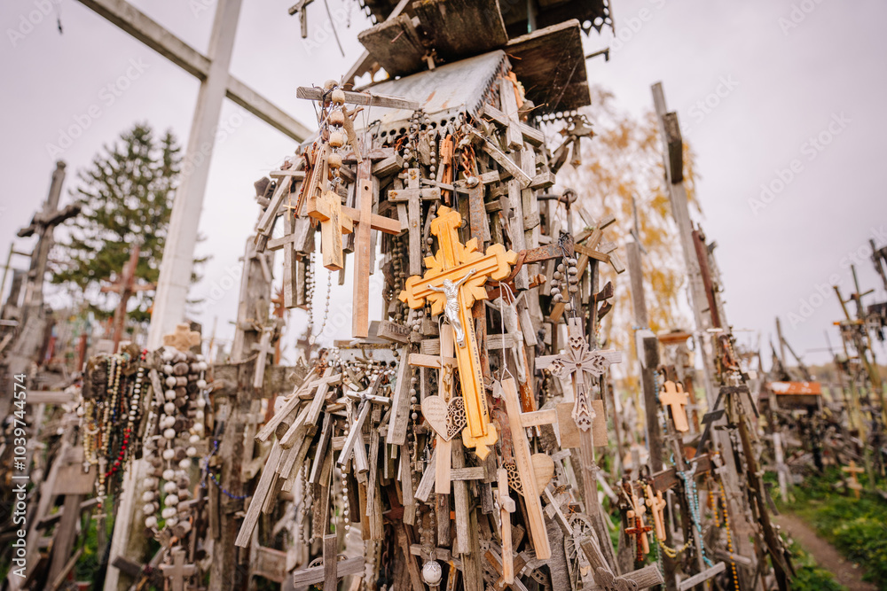 A large collection of wooden crosses, crucifixes, and rosaries ...