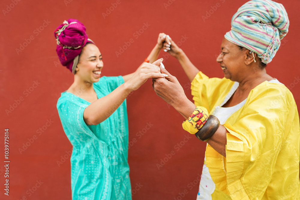 Foto de Happy african mother and daughter wearing traditional clothes - Motherhood, ethnic ...