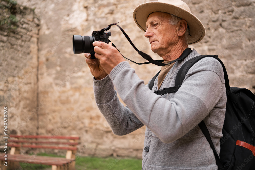 Retired photographer and tourist taking photos in ancient fortress ...