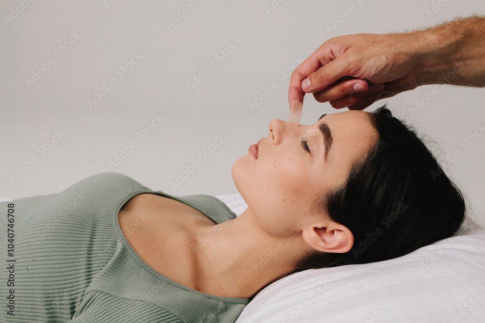 Bandaging nose after rhinoplasty or septoplasty to prevent bleeding and ...