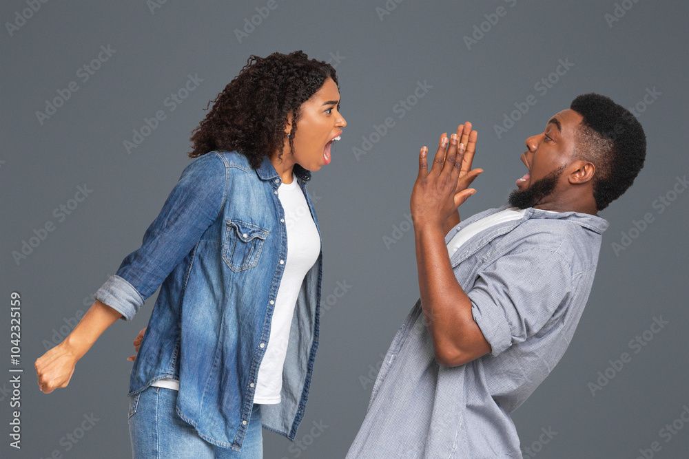 PMS Concept. Mad african american woman yelling at her scared boyfriend ...