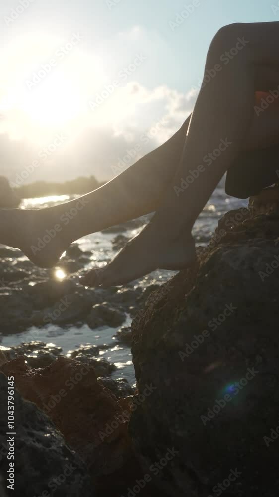 Feet Beach Sunset: A person's feet rest on a rock by the water ...