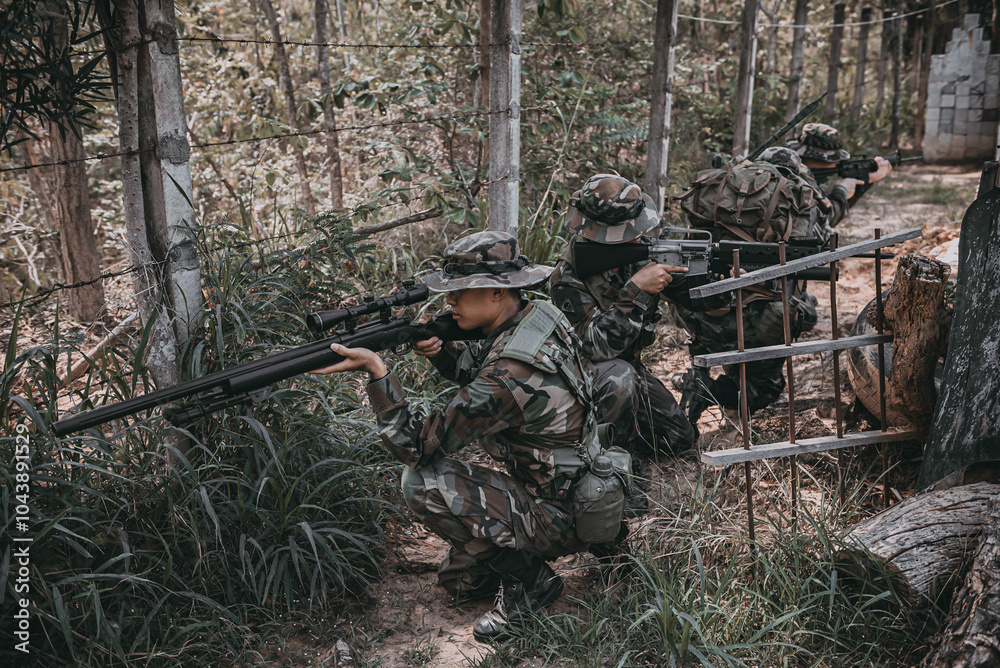 Team of army soldier with machine gun moving in the forest,Thai militia ...
