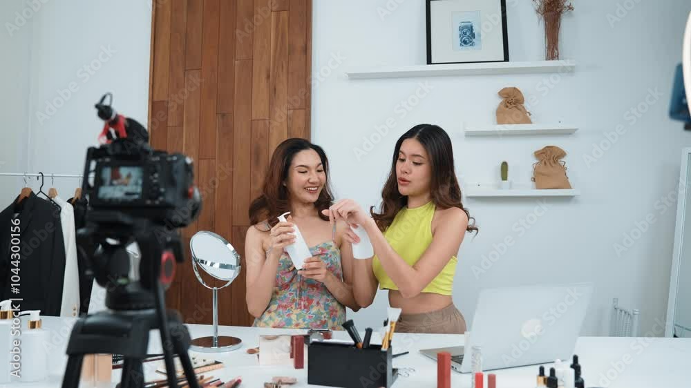 Two women influencer partner shoot live streaming vlog video review ...