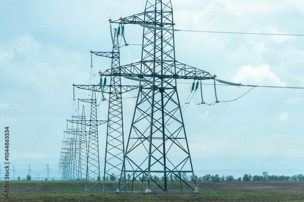 High voltage towers with sky background. Power line support with wires ...