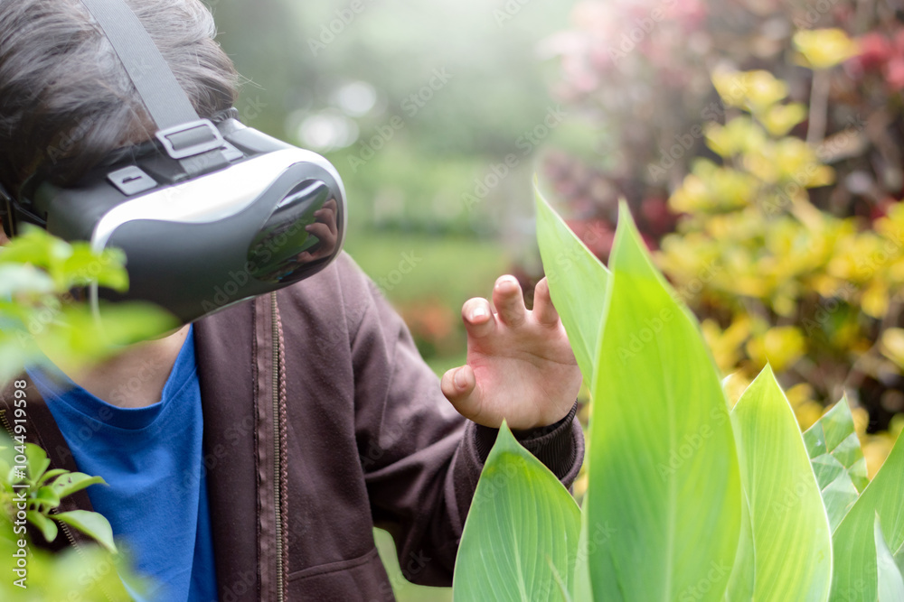 Asian highschool boy explores nature outside the classroom, observing ...
