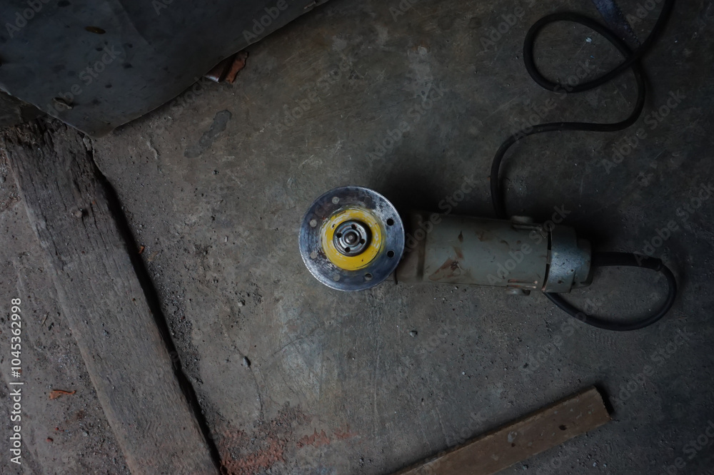Old and Worn Angle Grinder with Damaged Wheel and Power Cord Stock ...
