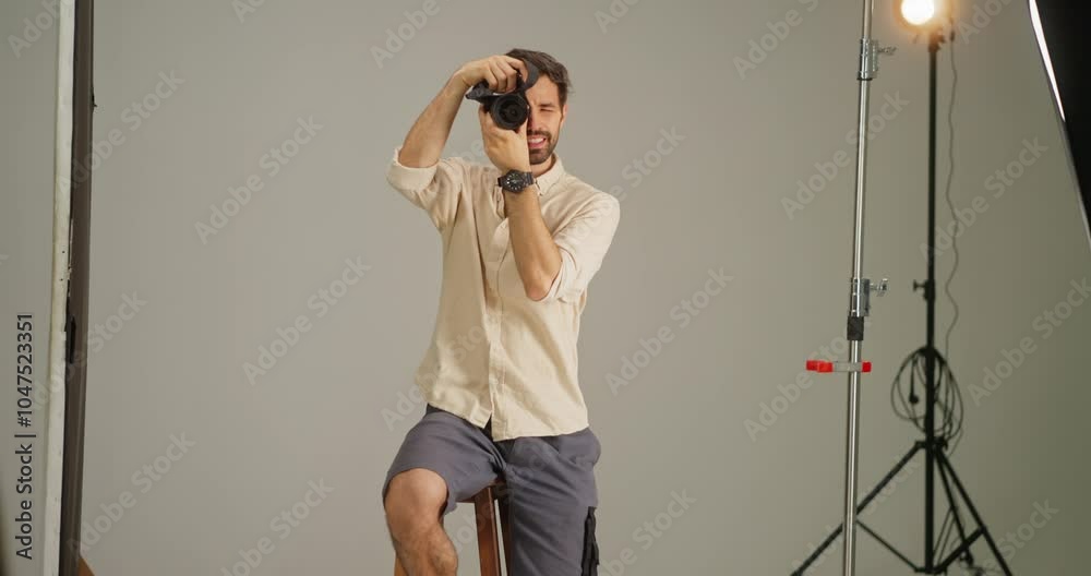 Over the shoulder portrait of a confident brunette guy with stubble ...
