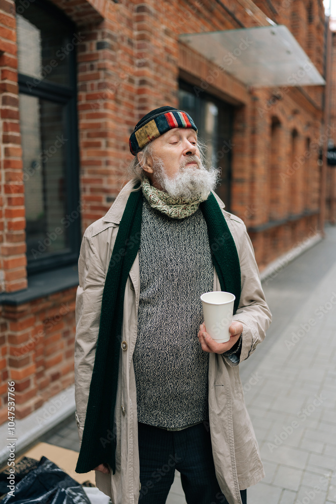 Vertical portrait of senior adult homeless man with lengthy white beard ...