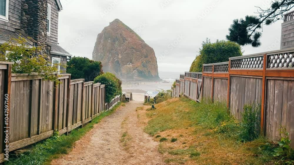 Haystack Rock Pathway to the beach with towering rock in the distance ...