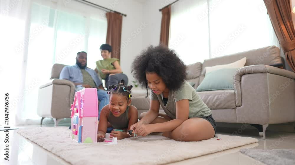 Happy family parents and child spending time together at home. Two ...