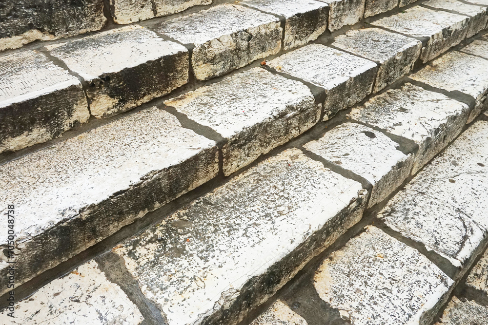 Ancient stone stairs texture. Worn, weathered blocks leading upward ...