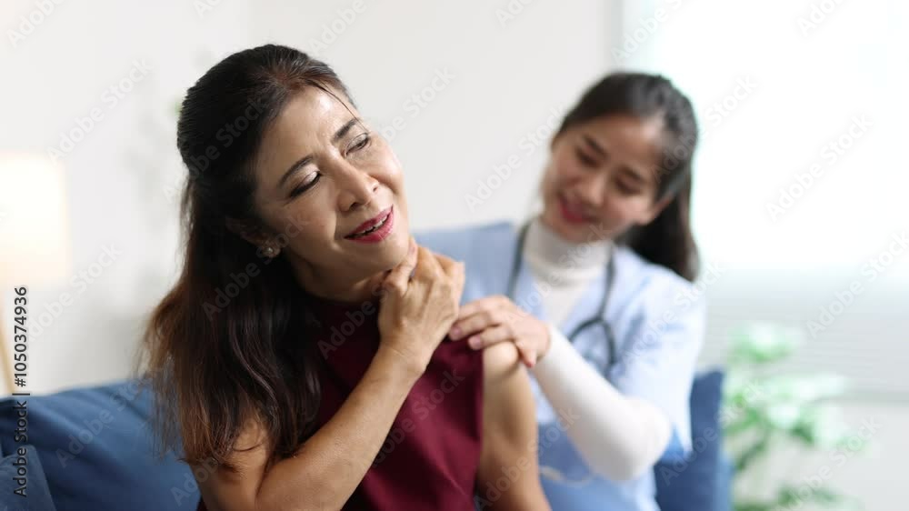 Doctor assessing arm mobility and shoulder function in a patient ...