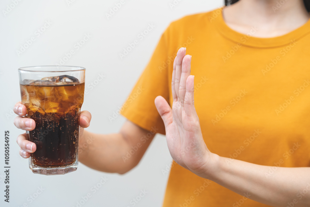 Diet, Dieting. Attractive asian young woman, girl push out cold cola ...