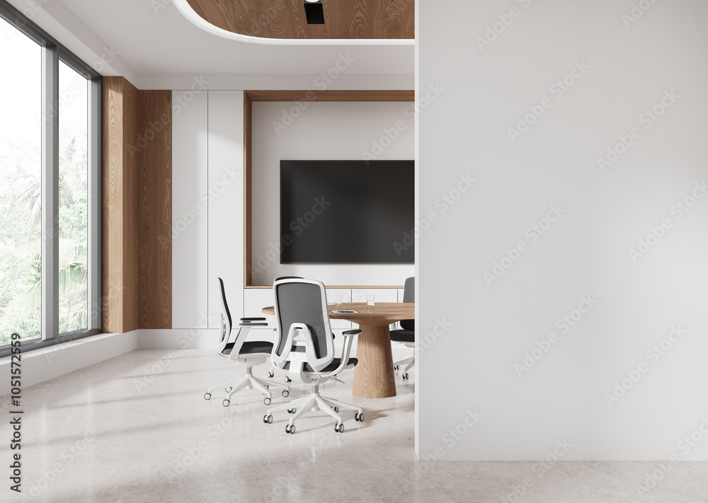 Modern office interior with large windows, blank wall and meeting room ...