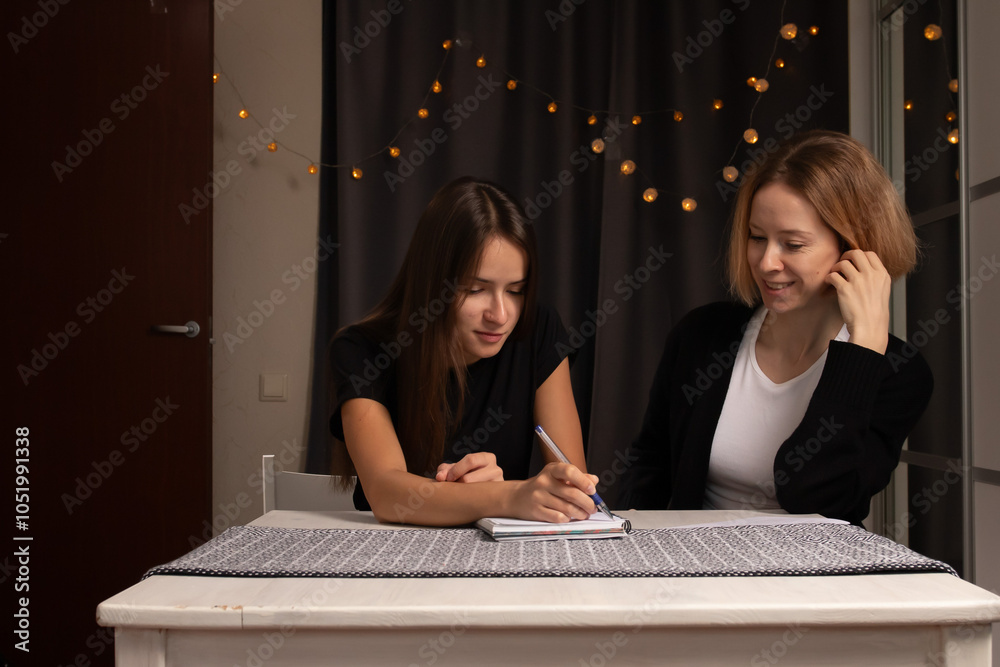 Mother and Daughter Writing in Notebook Together, writing and study ...