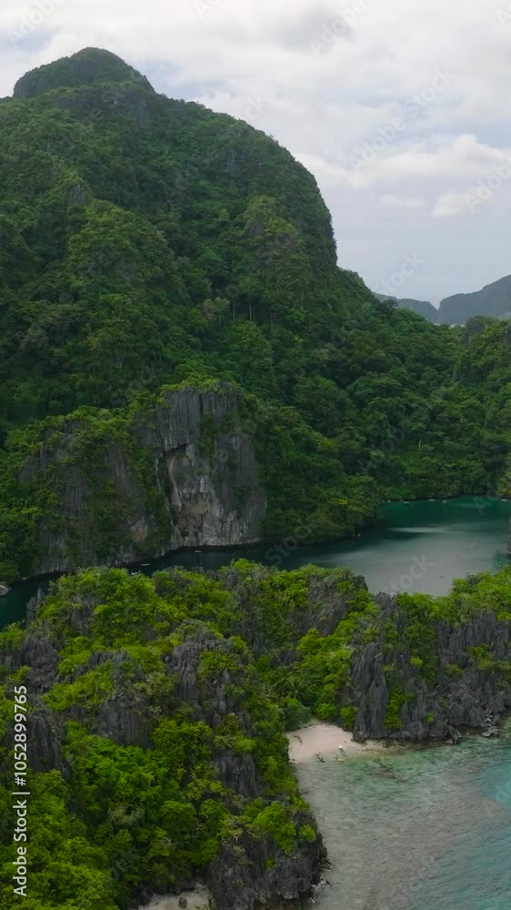 Lagoons in Miniloc Island surrounded by limestone tock formation ...