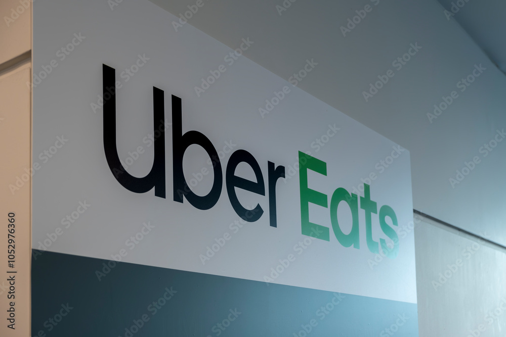 Uber Eats advertisement sign on the wall inside Toronto International ...