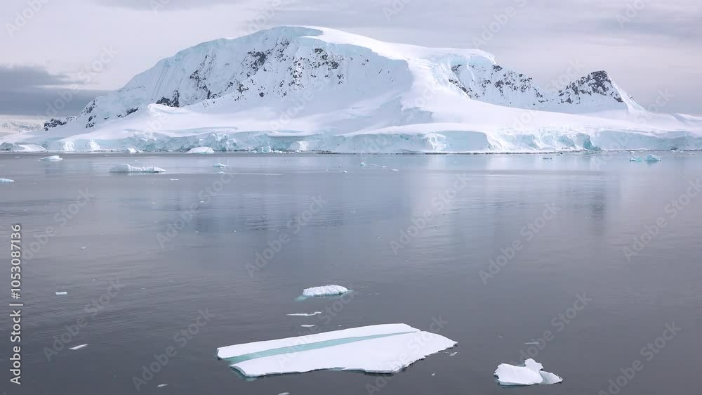Explore magnificent ice structures and serene waters as the Arctic ...