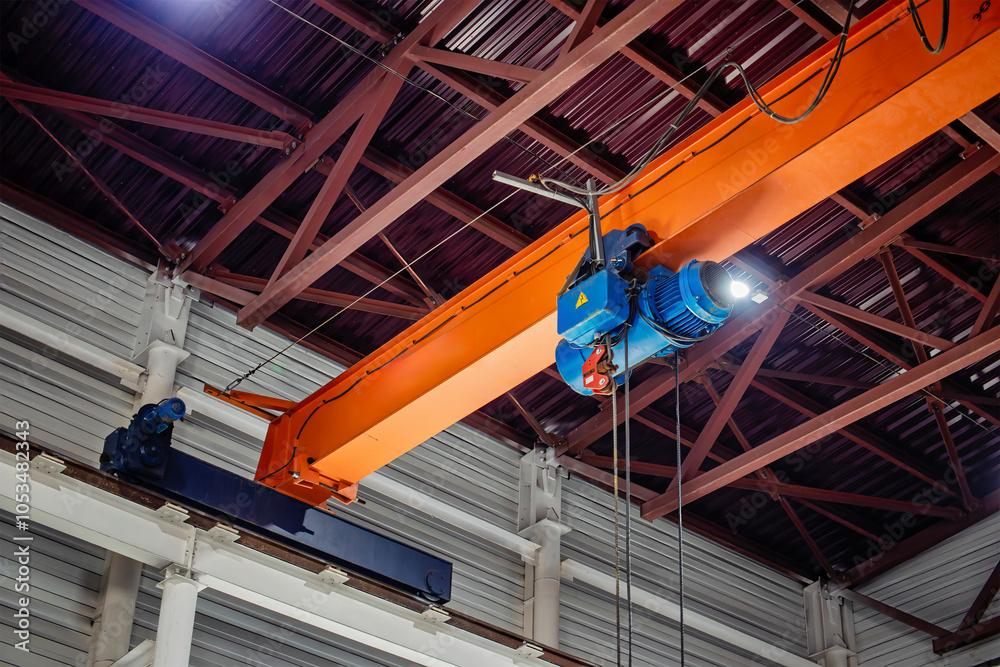 Crane beam with hoist system suspended from the ceiling in an ...