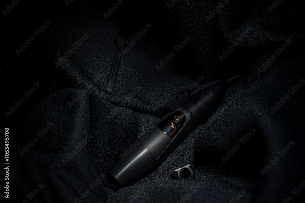 Electric clipper, trimmer. Top view isolated on black background. The ...