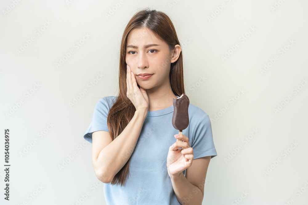 Face expression suffering from sensitive teeth and cold, asian young ...