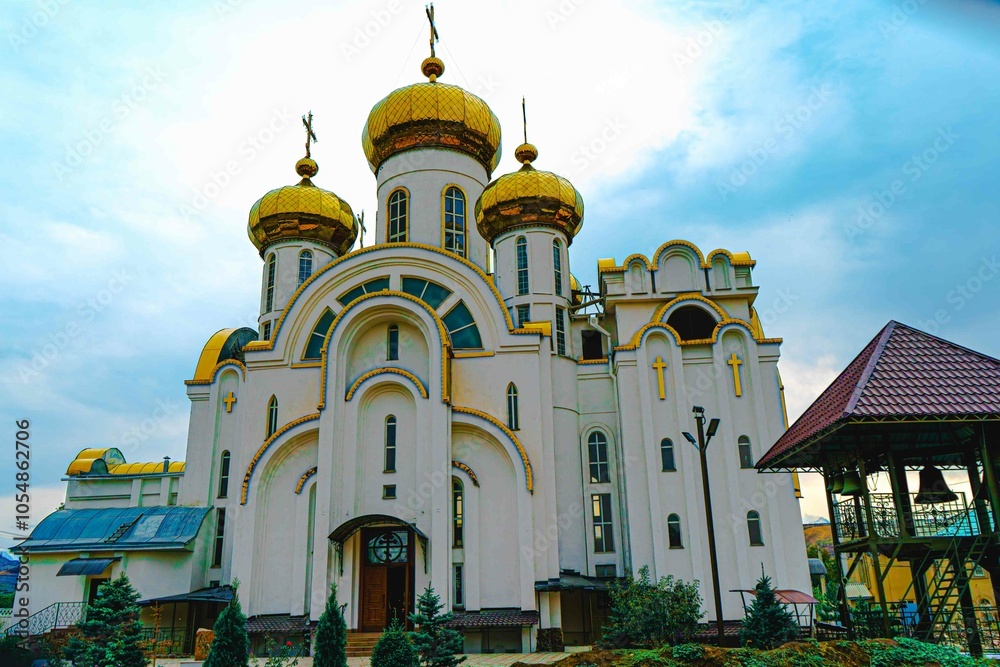 Ornate Orthodox church with golden domes and a detailed facade, set ...